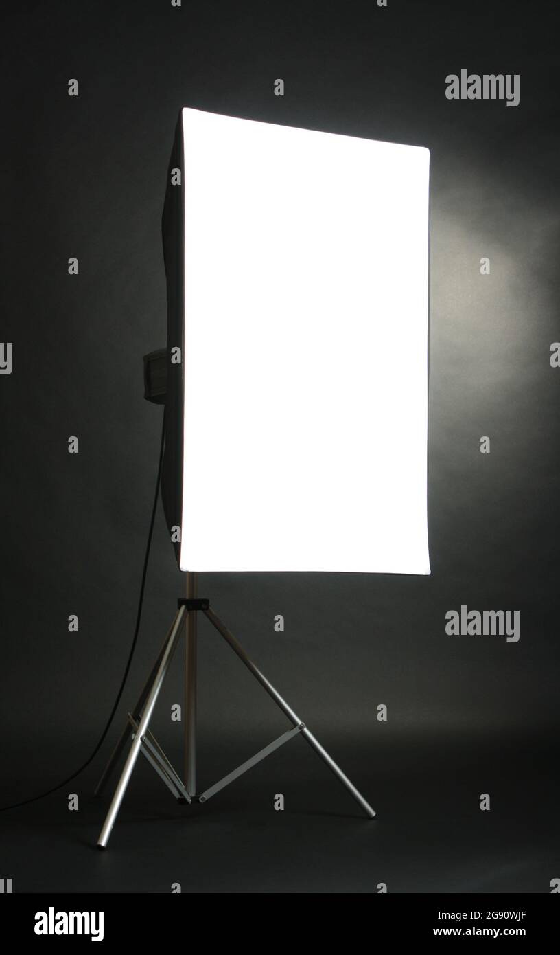 Studio flash with soft-box on black studio background Stock Photo - Alamy