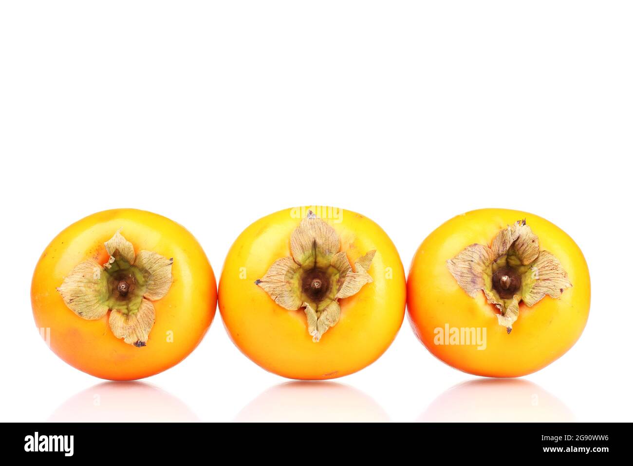 Three appetizing persimmons in line isolated on white Stock Photo - Alamy