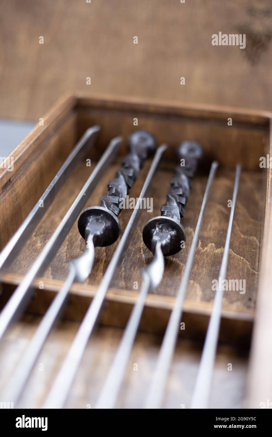 Shish kebab skewers in a wooden box Stock Photo - Alamy