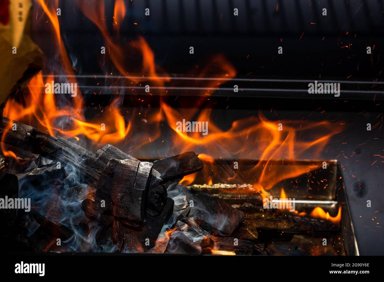 Barbecue grill pit with glowing and flaming hot open fire with red ...