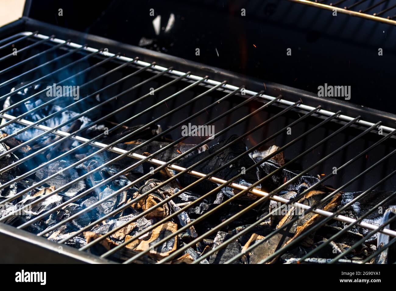 Barbecue grill pit with glowing and flaming hot open fire with red ...