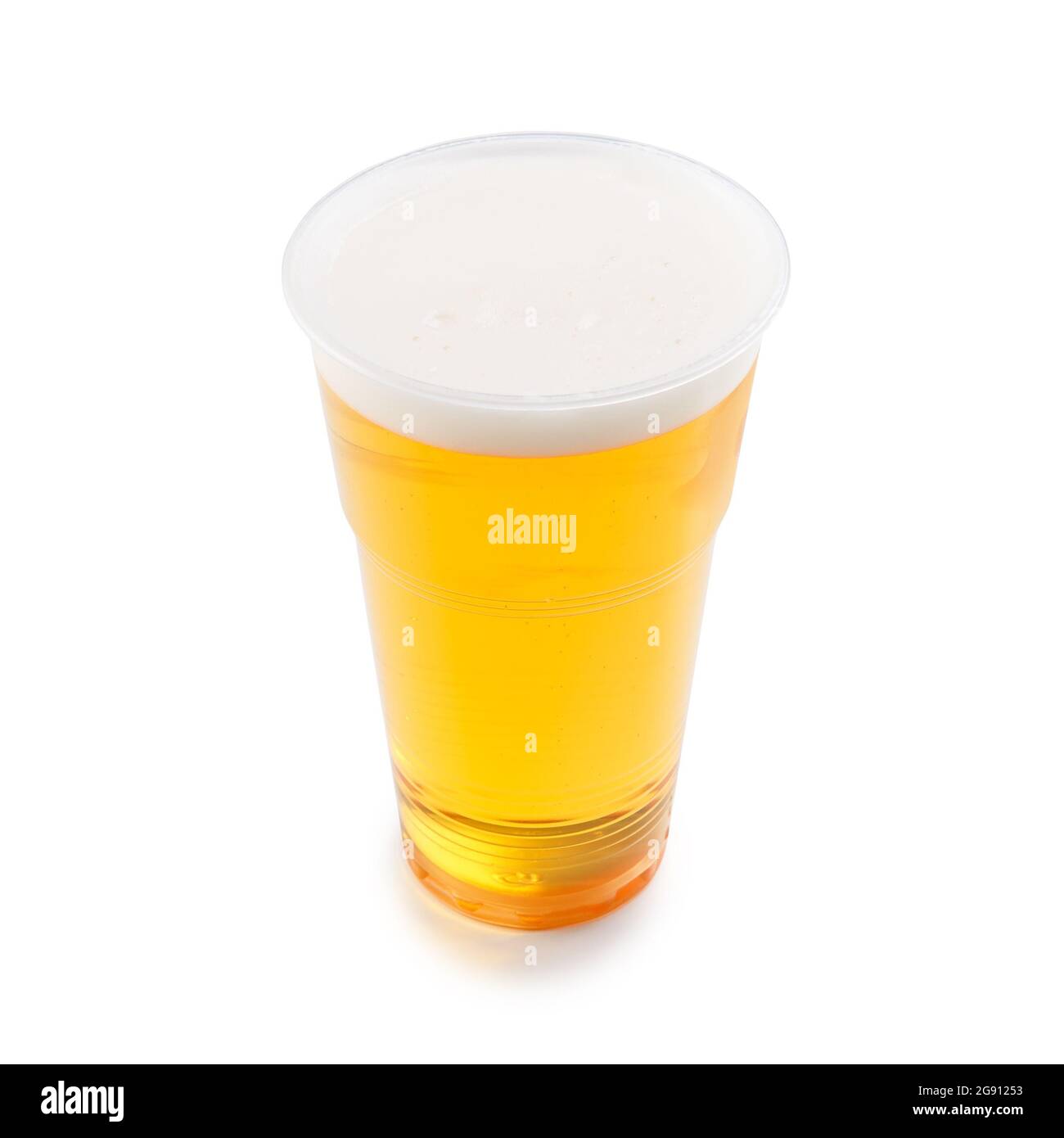 Beer, ale or lager in a plastic disposable cup isolated on white ...