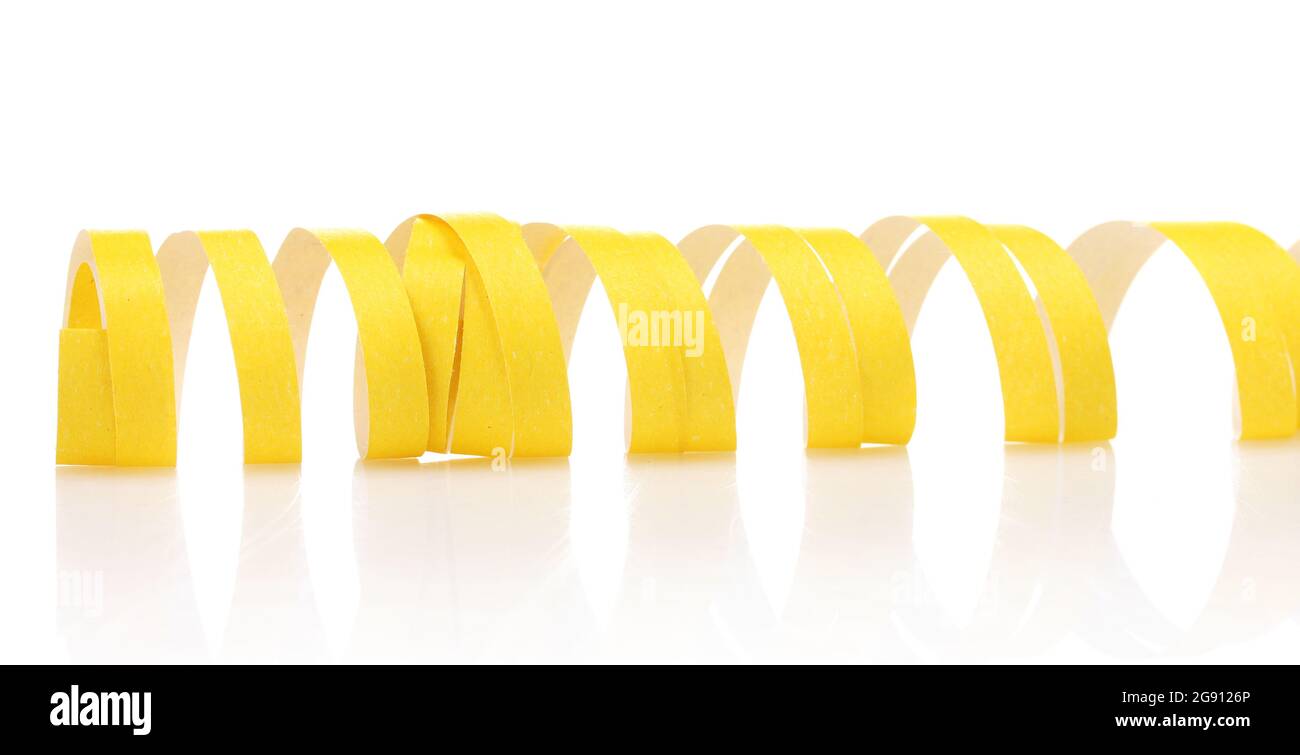 yellow streamer isolated on white Stock Photo - Alamy