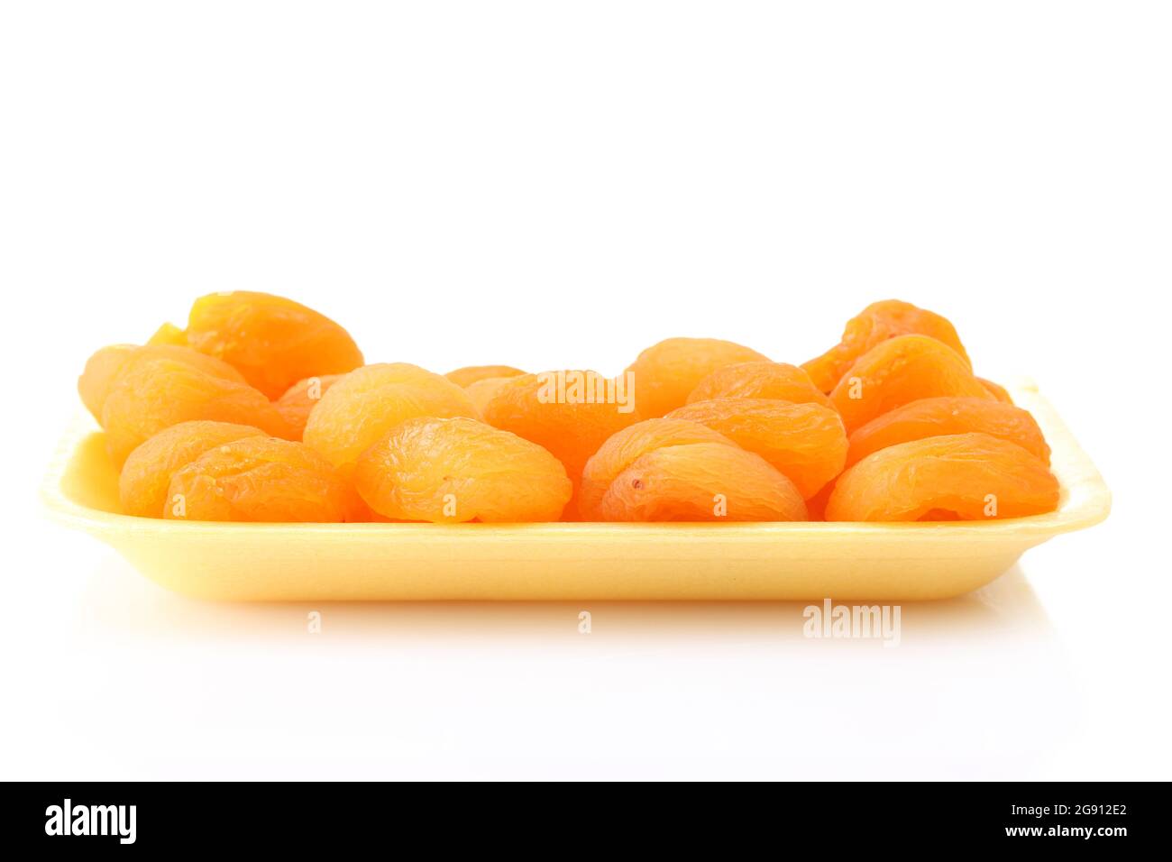 delicious dried apricots in packaging isolated on white Stock Photo - Alamy