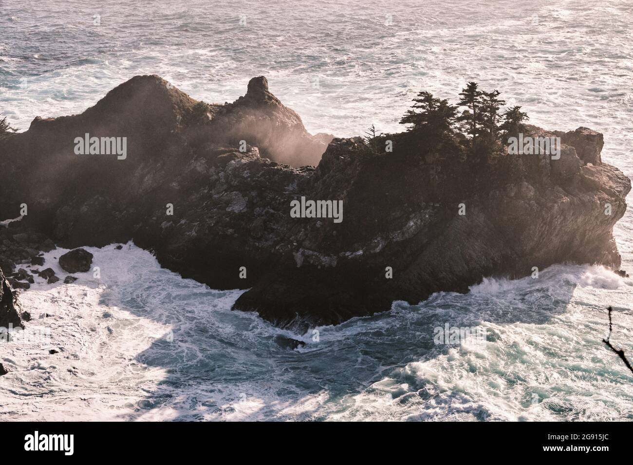 Wave crashing against rock on the beach hi-res stock photography and ...