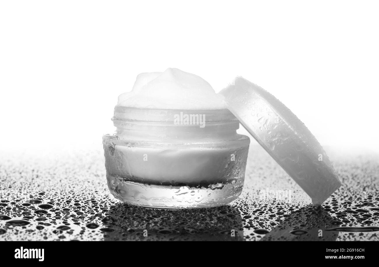 cosmetic cream on table isolated on white Stock Photo - Alamy