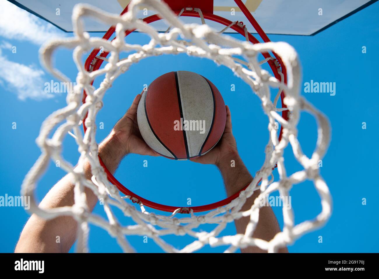 Basketball player in action flying high and scoring. Basketball as a ...