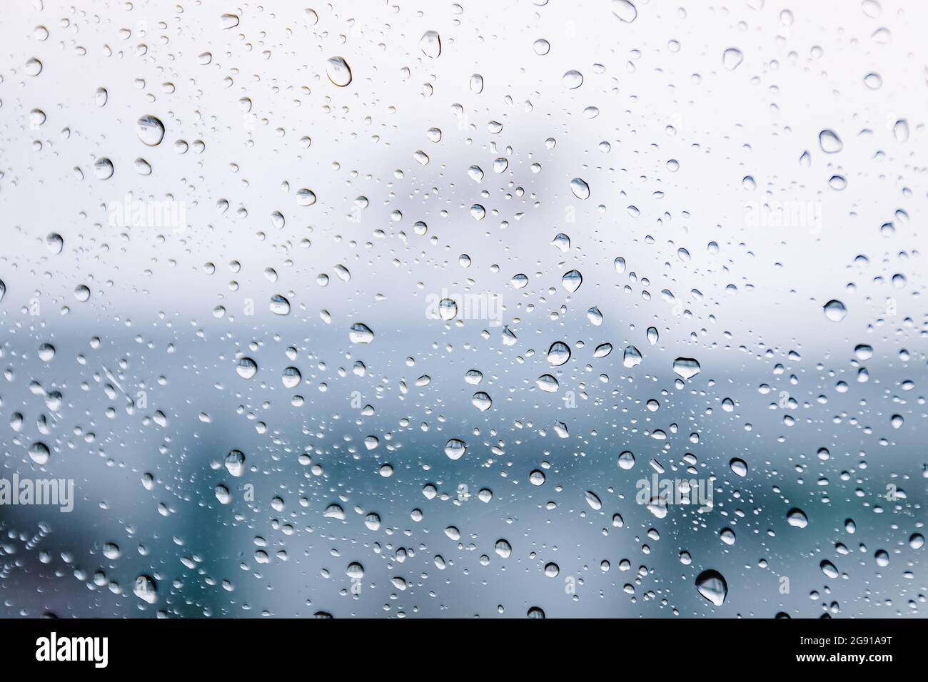Rain Drops On Surface of wet Window Glass pane In Rainy Season ...