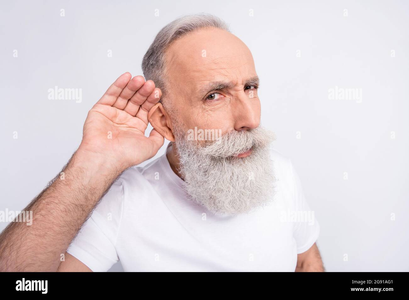 Portrait of sad grey hair beard old man not hear wear white t-shirt ...