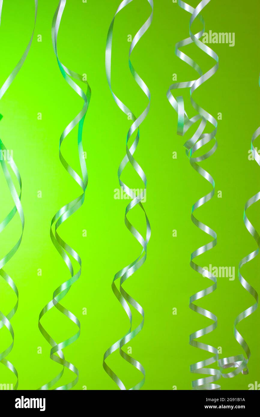 beautiful streamers on green background Stock Photo - Alamy