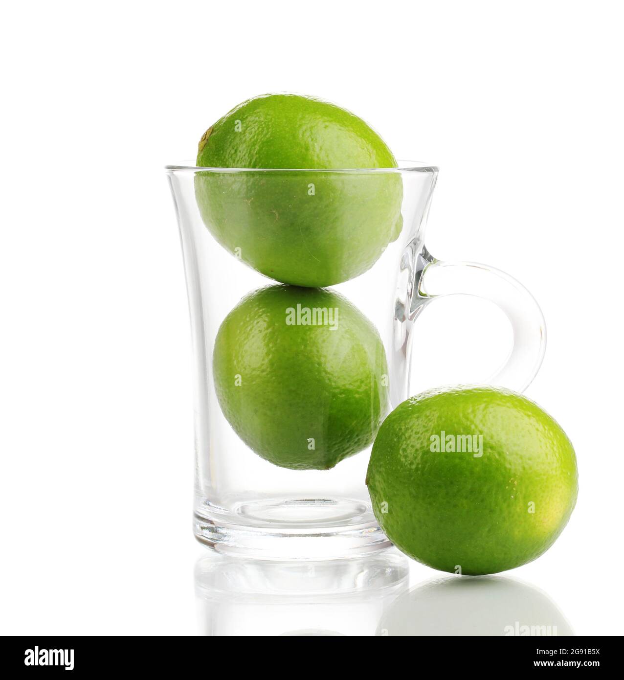 Fresh limes in glass cup isolated on white Stock Photo - Alamy
