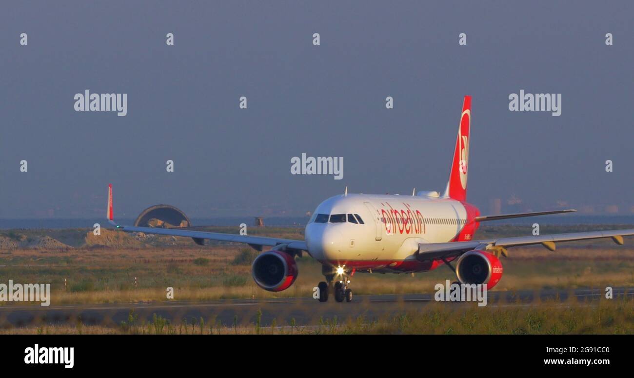 Airplane making a turn on runway Stock Photo - Alamy