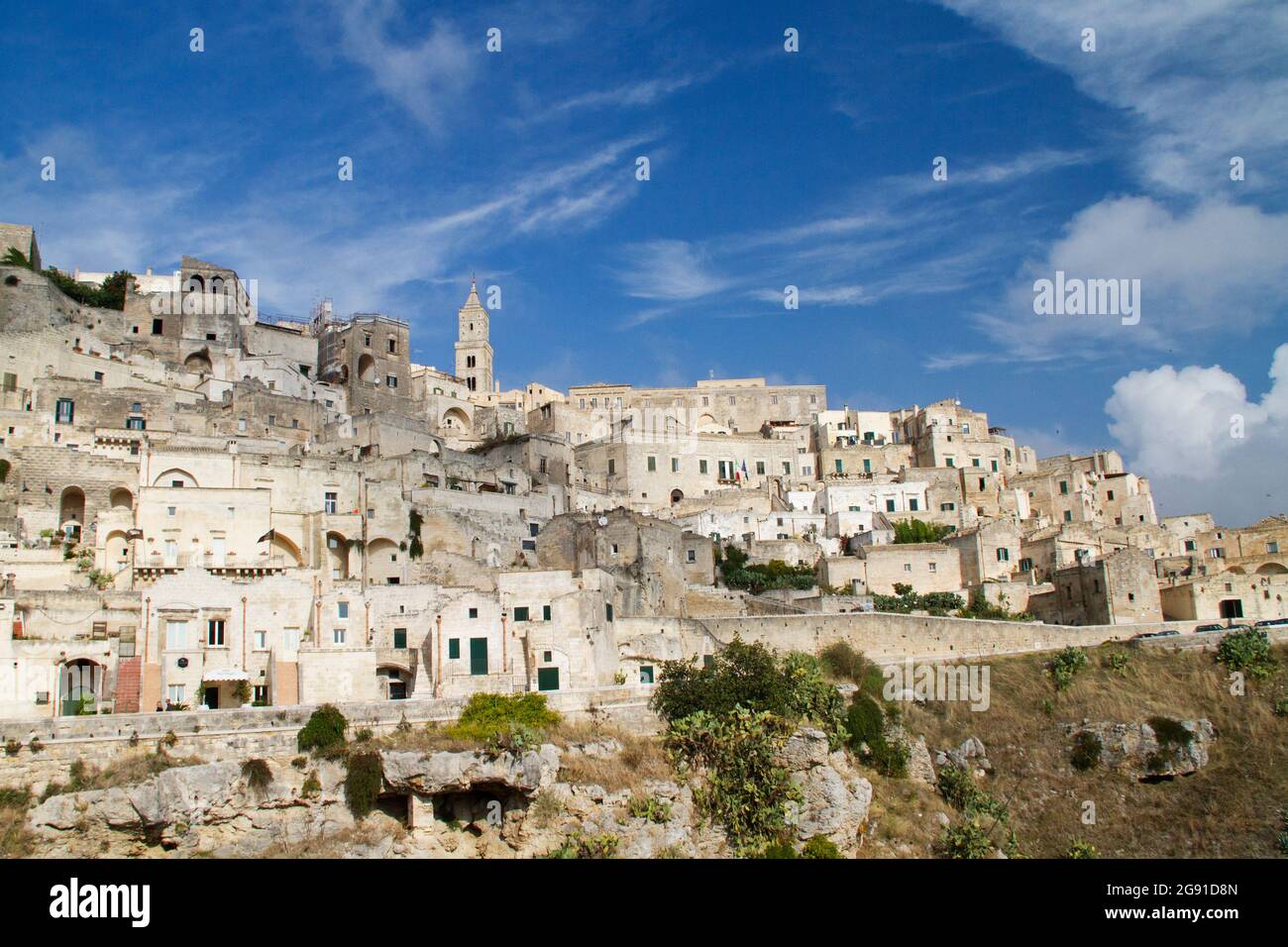 Matera is built on the slope of a mountain with many of the houses ...