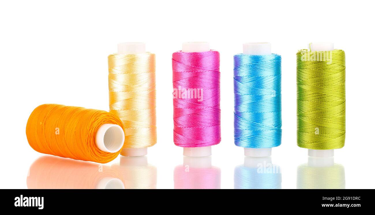 Many spools of thread isolated on white Stock Photo - Alamy