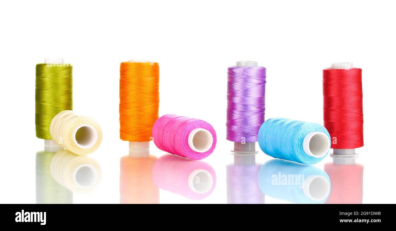 Many spools of thread isolated on white Stock Photo - Alamy