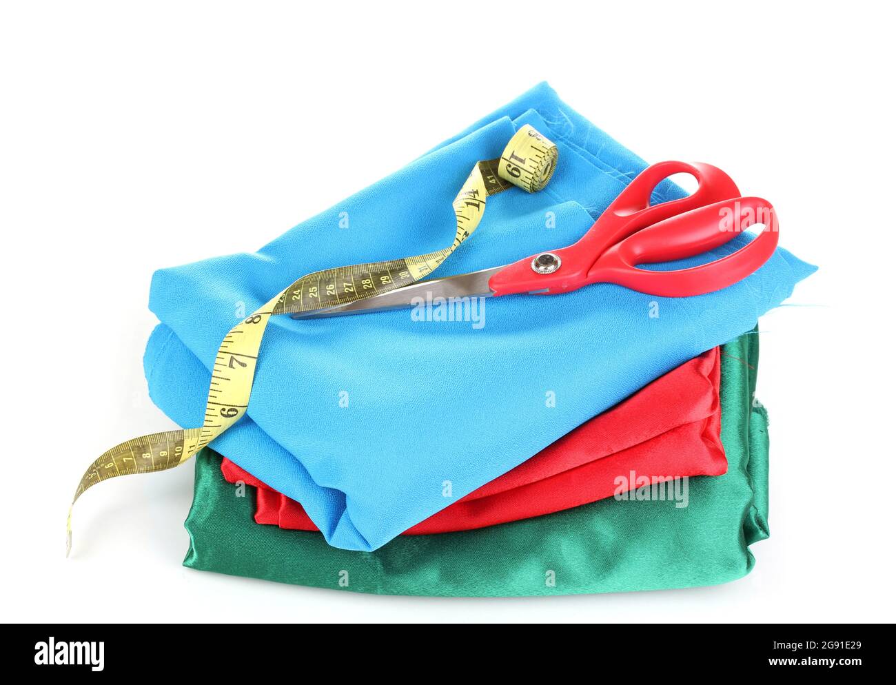 Scissors and measuring tape on fabric isolated on white Stock Photo - Alamy