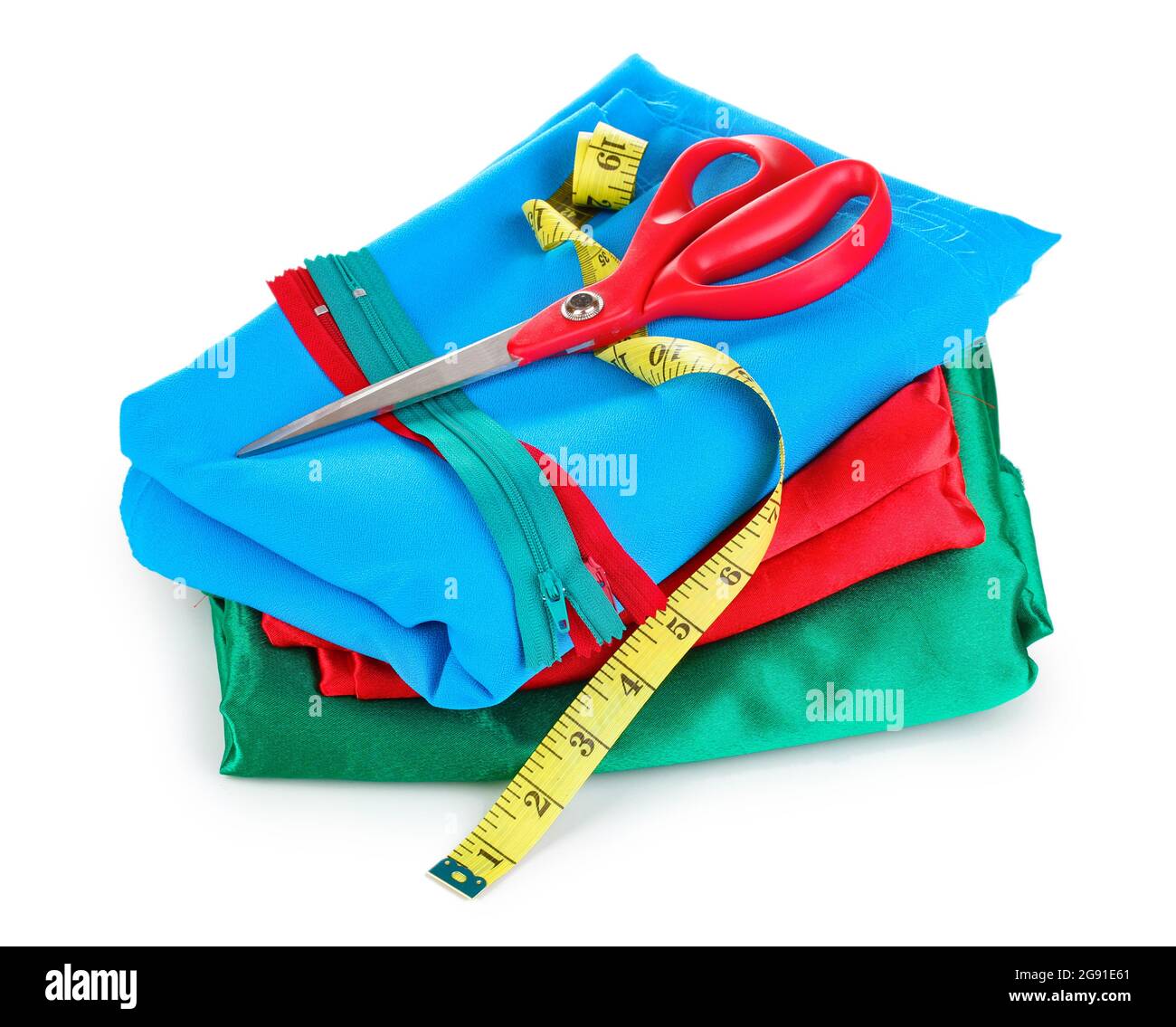 Scissors, zip and measuring tape on fabric isolated on white Stock ...