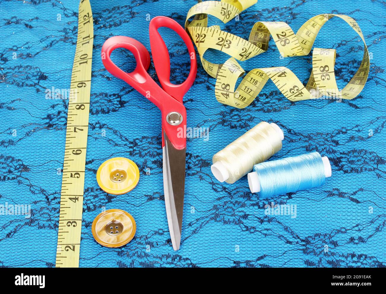 Sewing accessories on fabric Stock Photo - Alamy