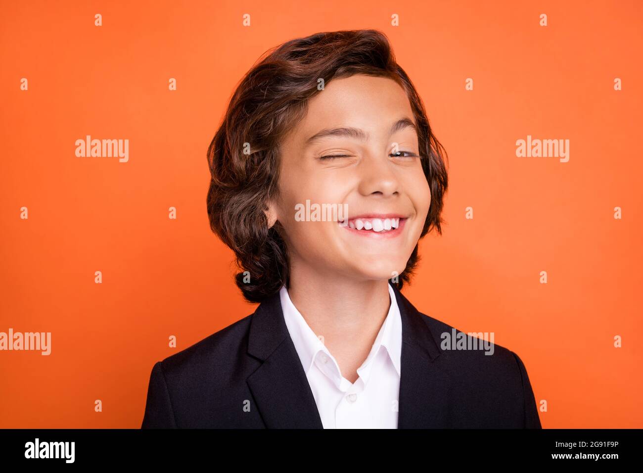 Photo of funky young happy positive little boy wink eye smile good mood ...