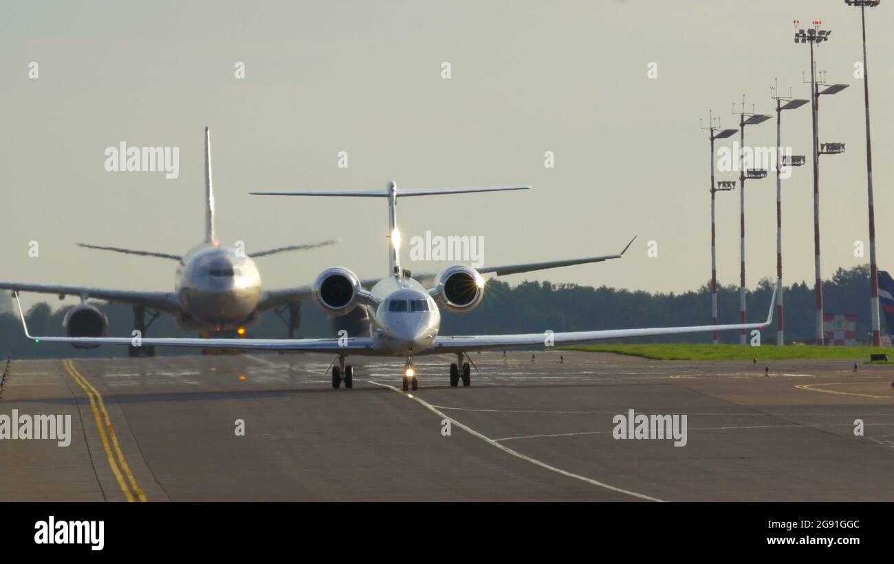 Two airplanes on the air strip Stock Photo - Alamy