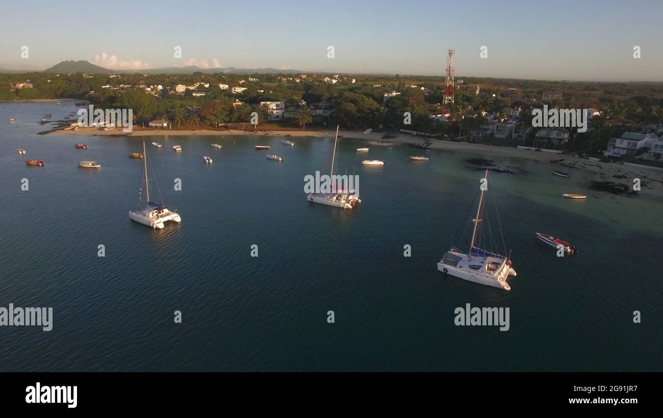 Flying over yachts and houses on Mauritius coast Stock Photo - Alamy