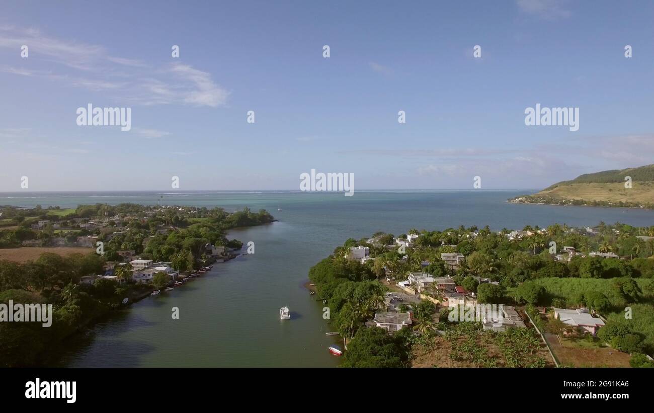 Coastal town and river falling into ocean Mauritius aerial view Stock ...