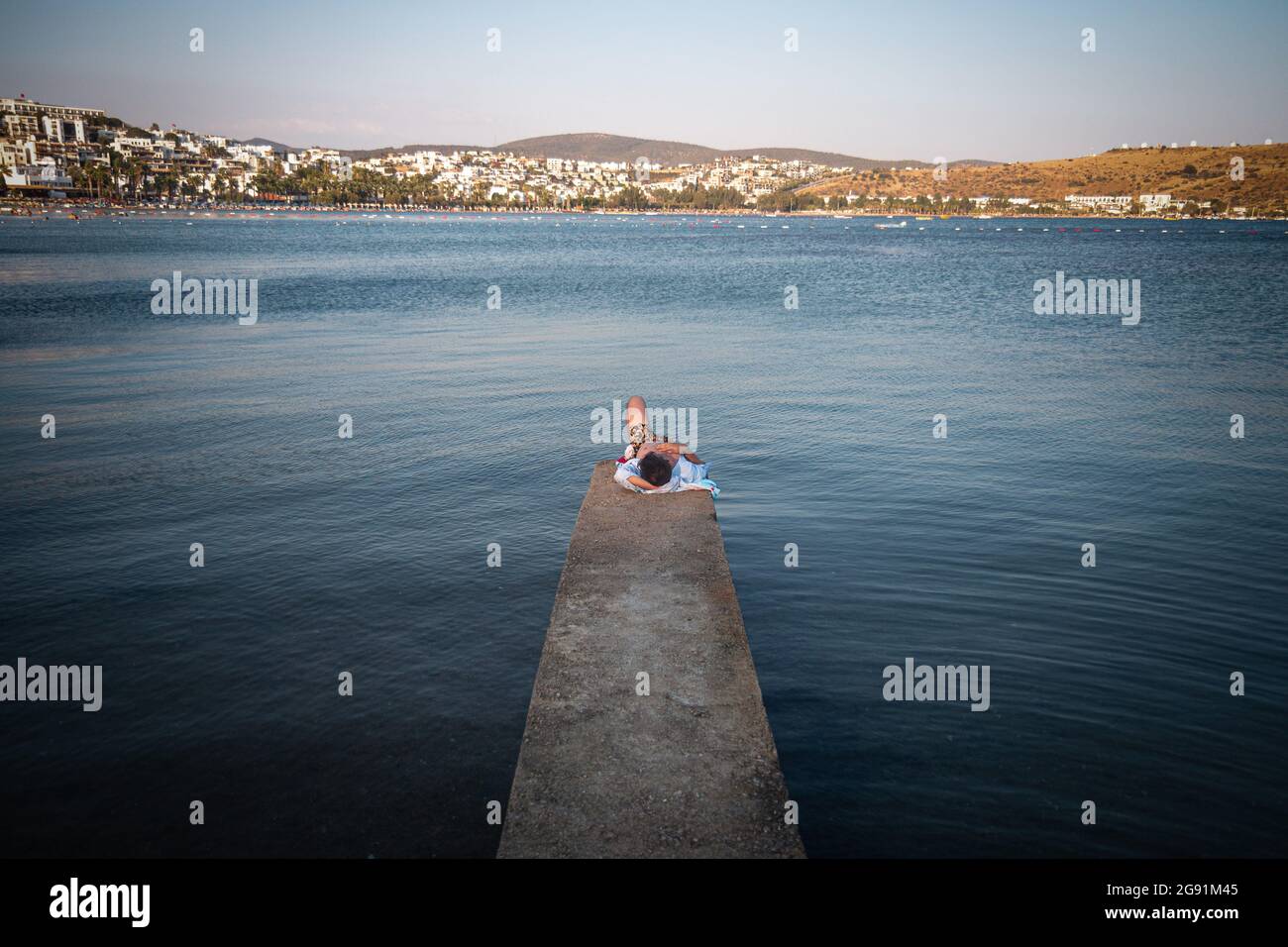 A man seen sunbathing at Bodrum Beach.One of most popular touristic ...