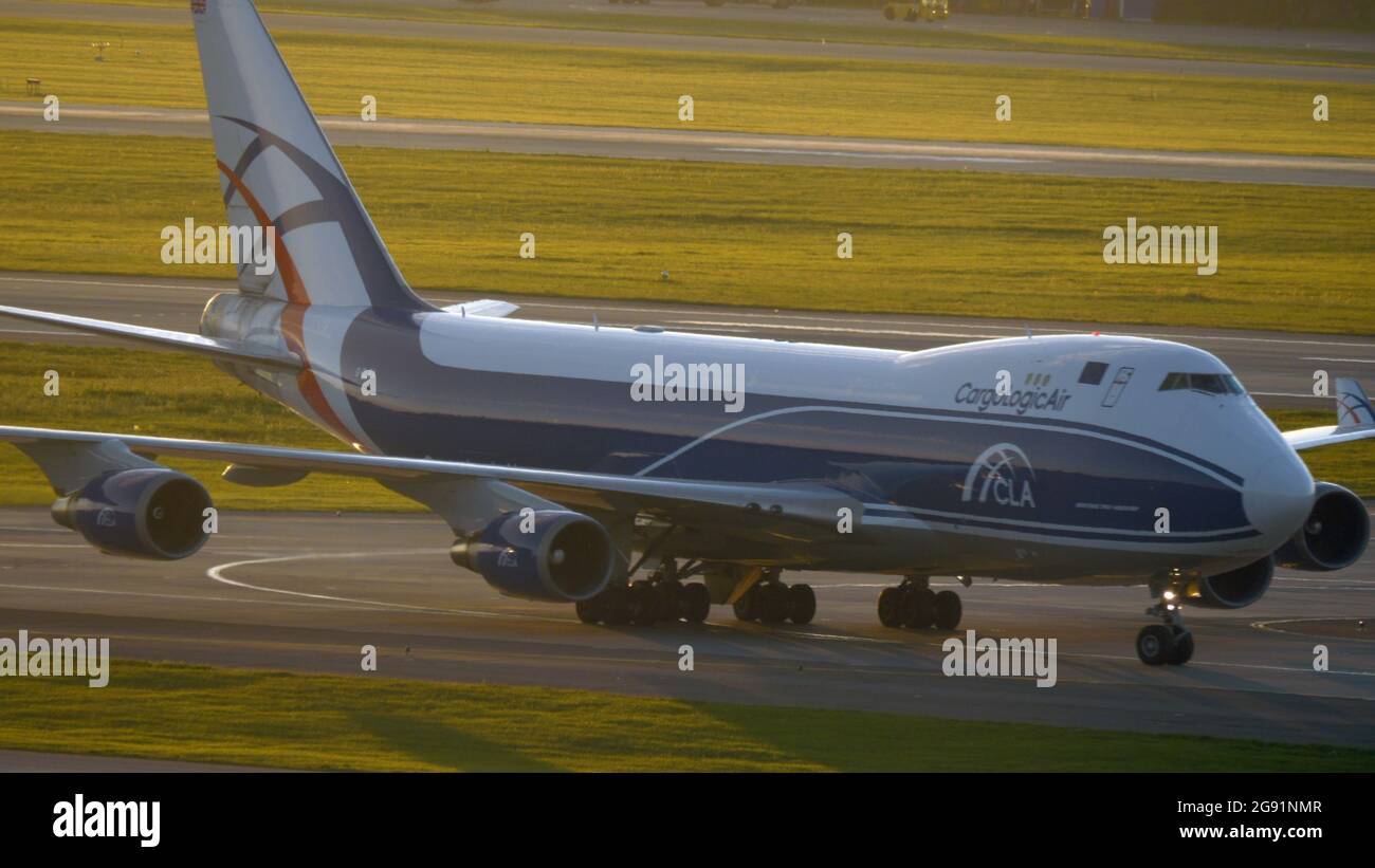 British cargo airplane driving to runway at sunset Stock Photo - Alamy