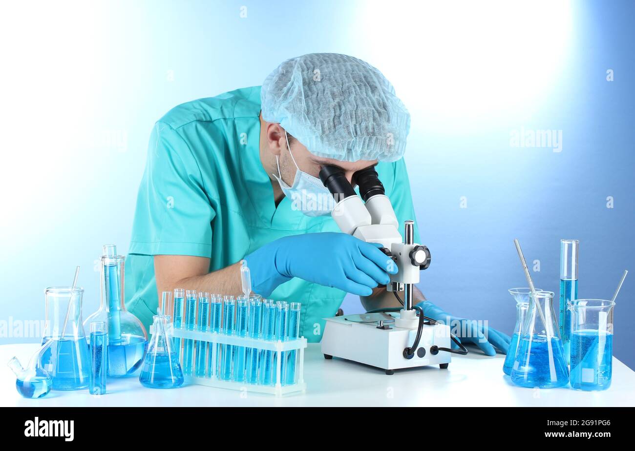 scientist in the lab working with microscope Stock Photo - Alamy