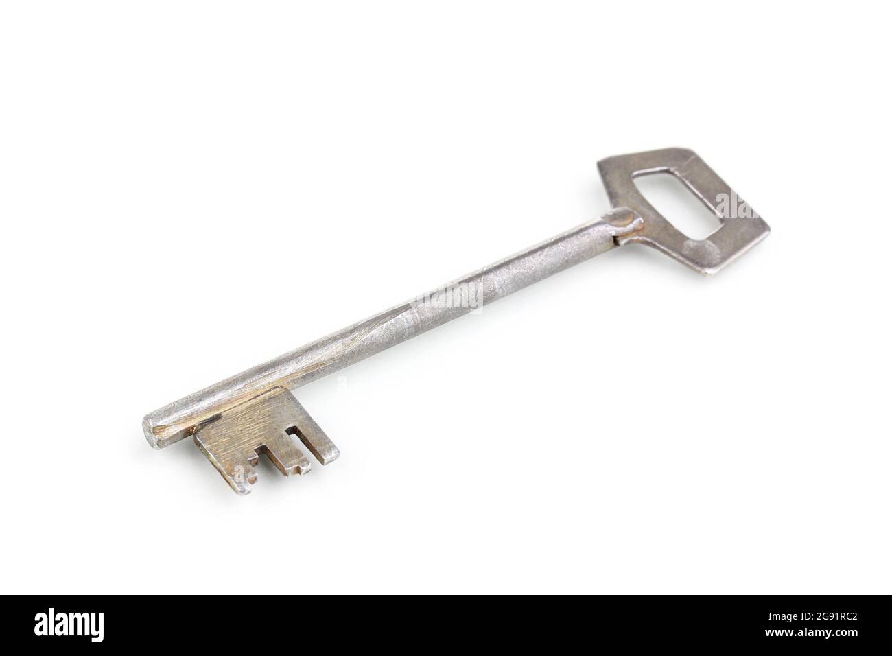 Metal key isolated on white Stock Photo - Alamy