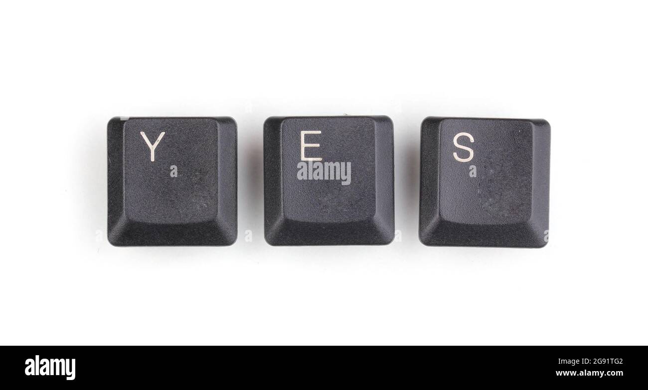 Keyboard keys saying yes isolated on white Stock Photo - Alamy