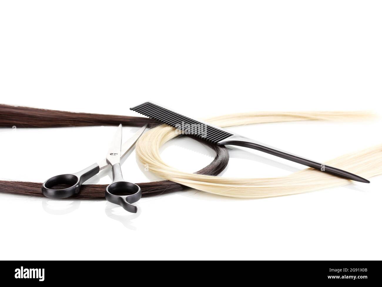 Shiny blond and brown hair with hair cutting shears and comb isolated ...