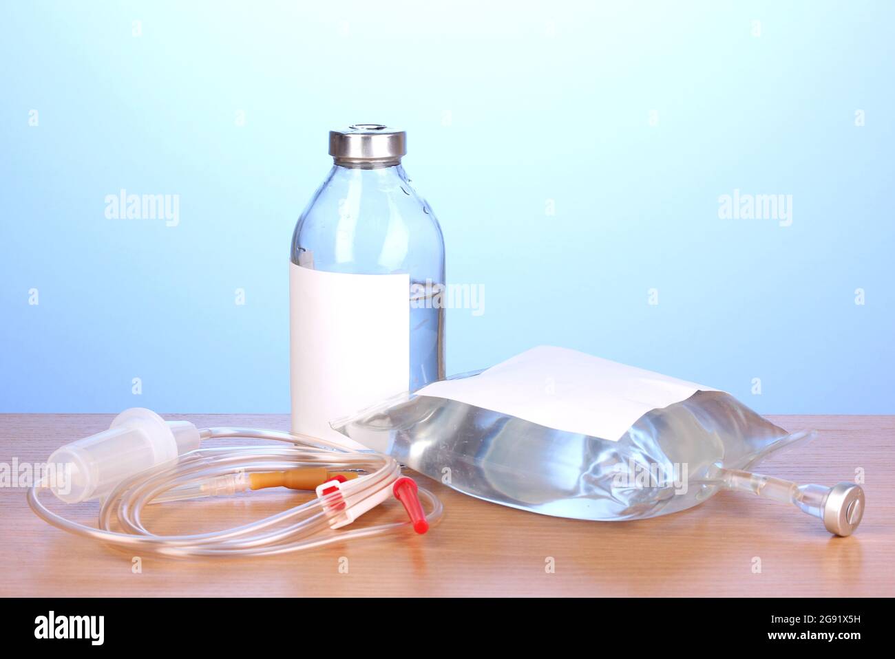 Bottle and bag of intravenous antibiotics and plastic infusion set on ...