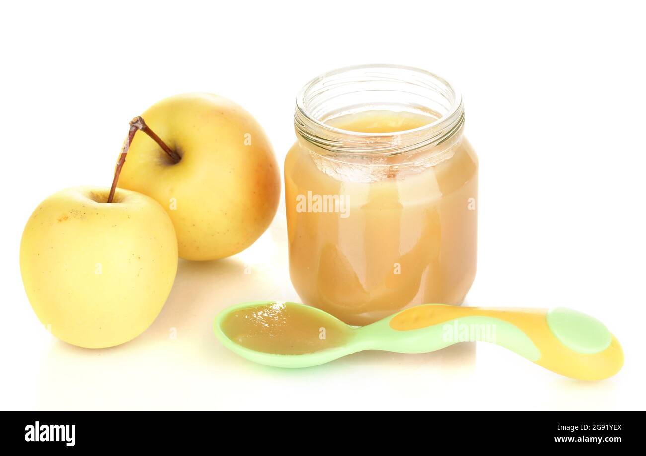 Jar of baby puree with apple and spoon isolated on white Stock Photo ...