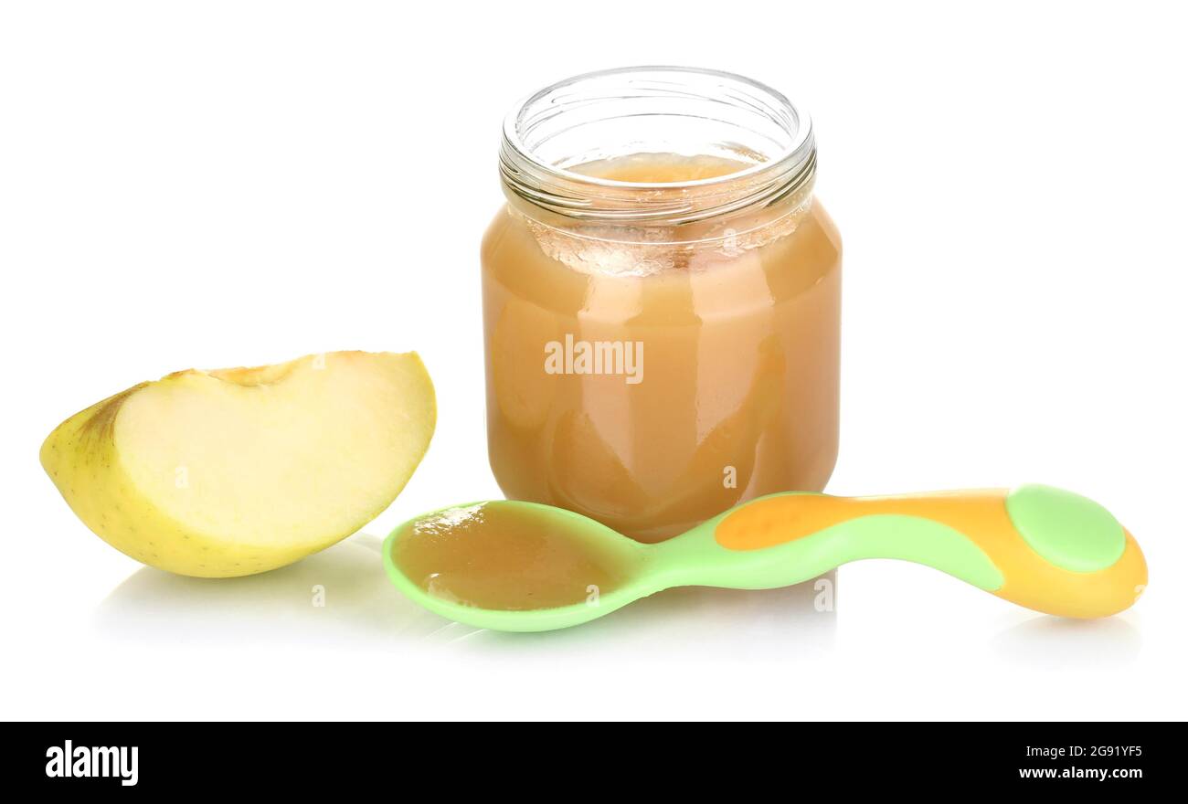 Jar of baby puree with apple and spoon isolated on white Stock Photo ...