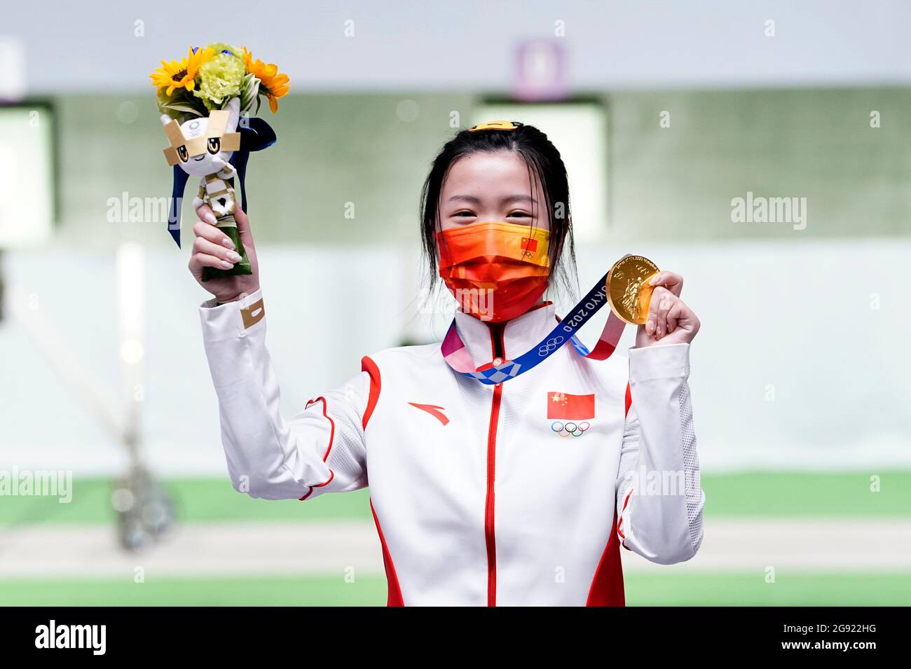 China's Qian Yang celebrates with her gold medal after winning the 10m ...