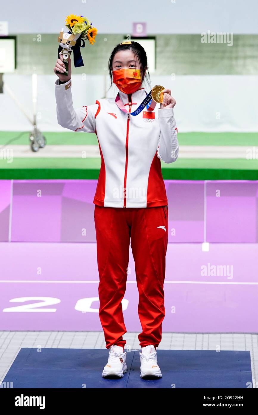 China's Qian Yang celebrates with her gold medal after winning the 10m ...