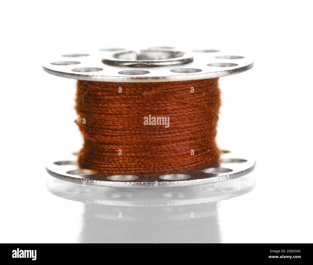 Metal spool of thread isolated on white Stock Photo - Alamy
