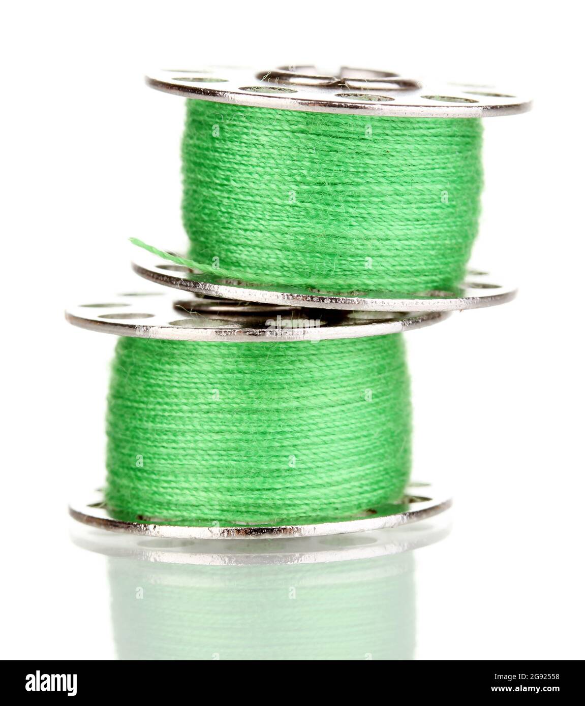 Metal spools of thread isolated on white Stock Photo - Alamy