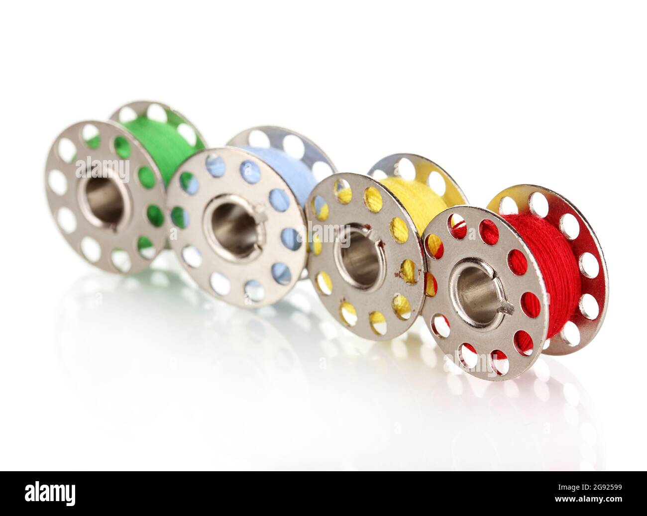 Metal spools of thread isolated on white Stock Photo - Alamy
