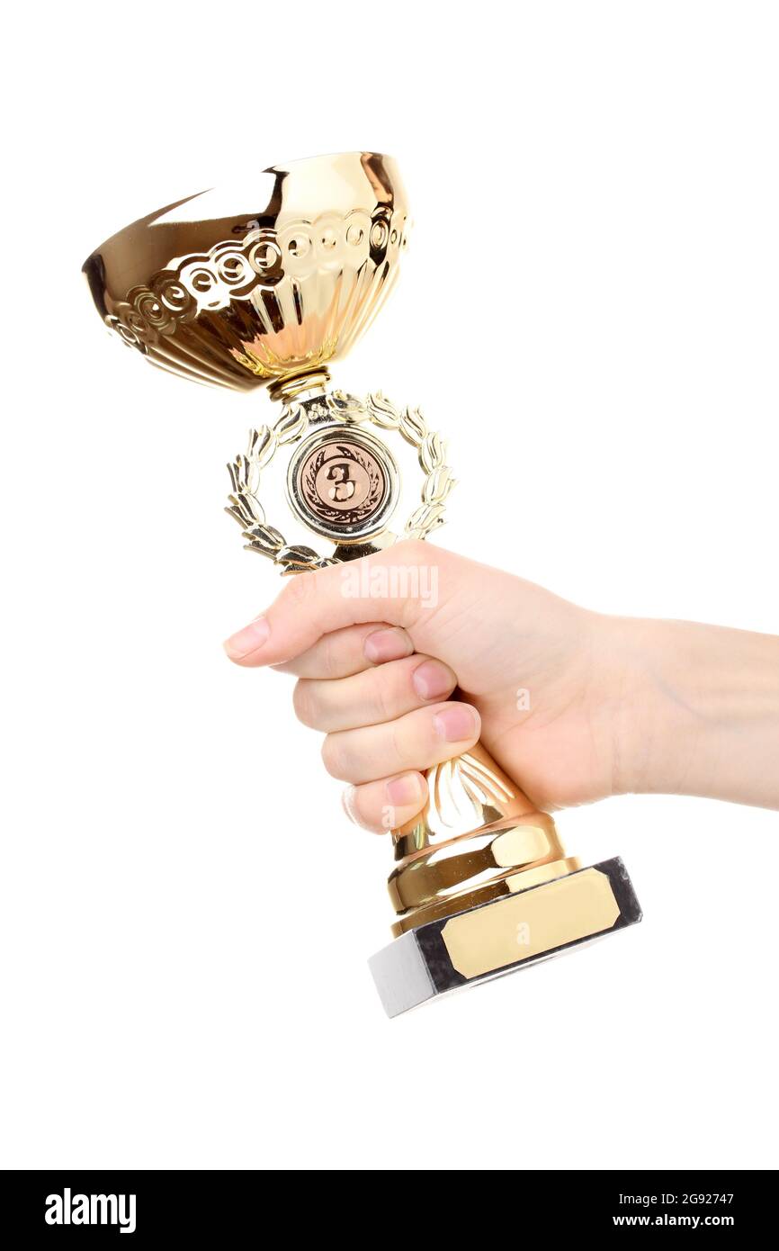 Trophy cup in hand isolated on white Stock Photo - Alamy