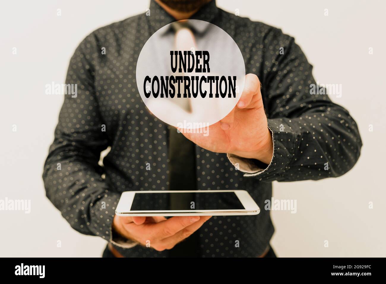 Sign displaying Under Construction. Word for project that is unfinished ...