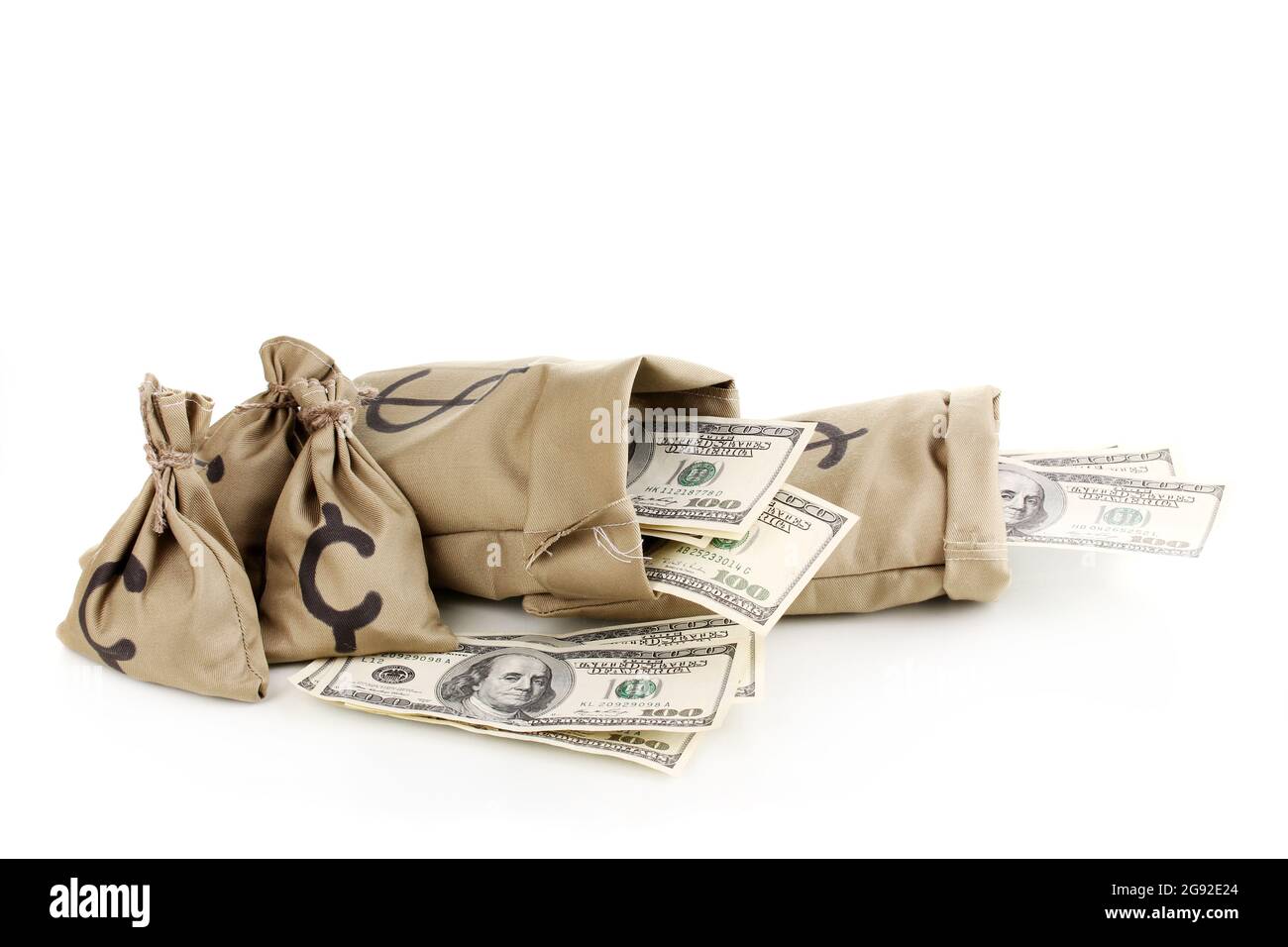 Bags with money isolated on white Stock Photo - Alamy