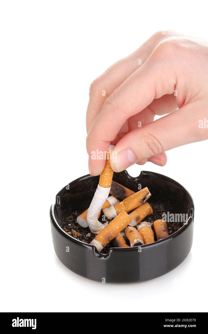 Putting out cigarette butt isolateed on white Stock Photo - Alamy