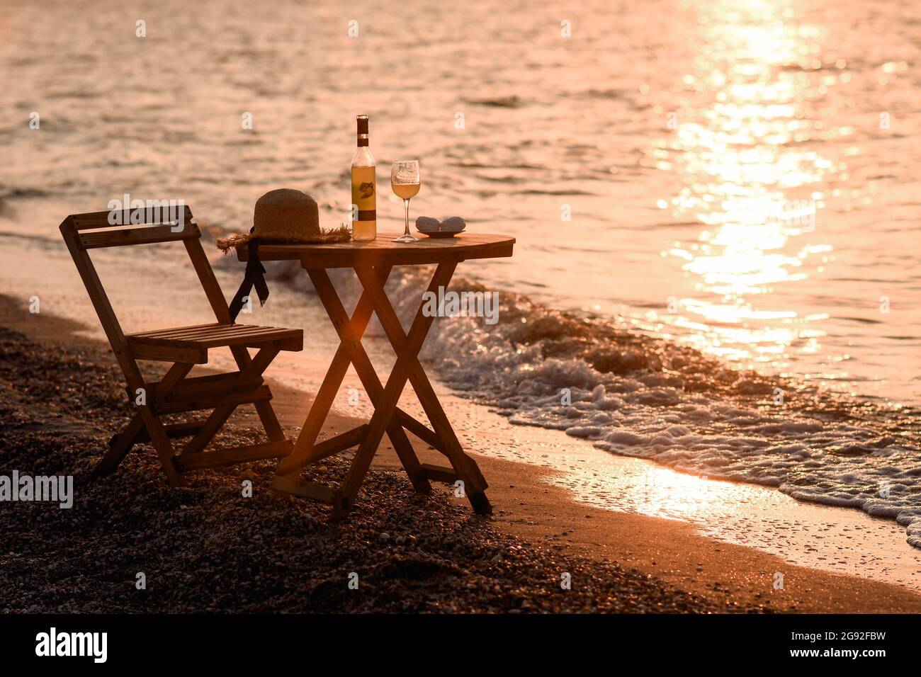 sunrise meeting on the seashore on the beach Stock Photo - Alamy