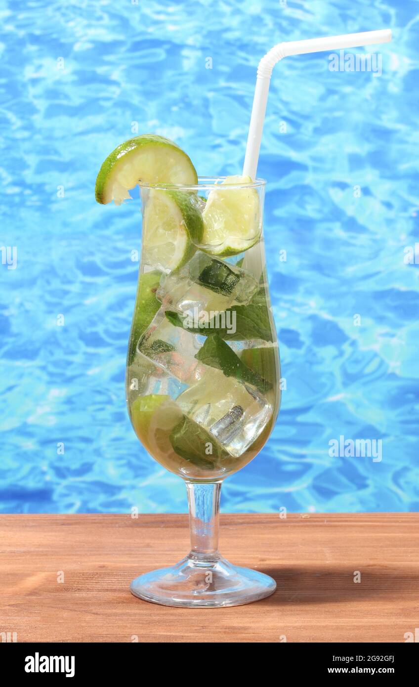 cold fresh lemonade on wooden table on sea background Stock Photo - Alamy