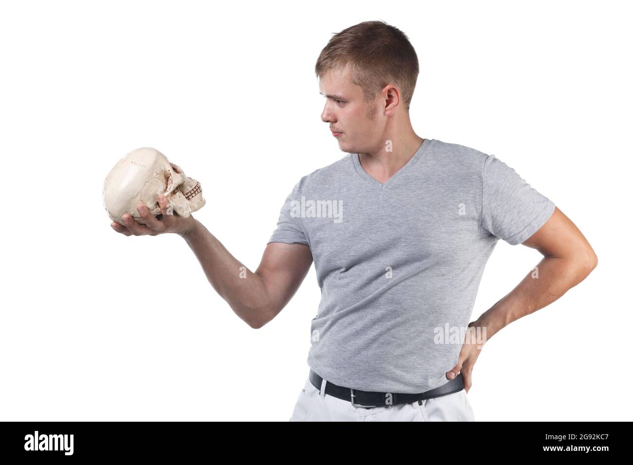 Photo of bristle man holding human skull Stock Photo - Alamy