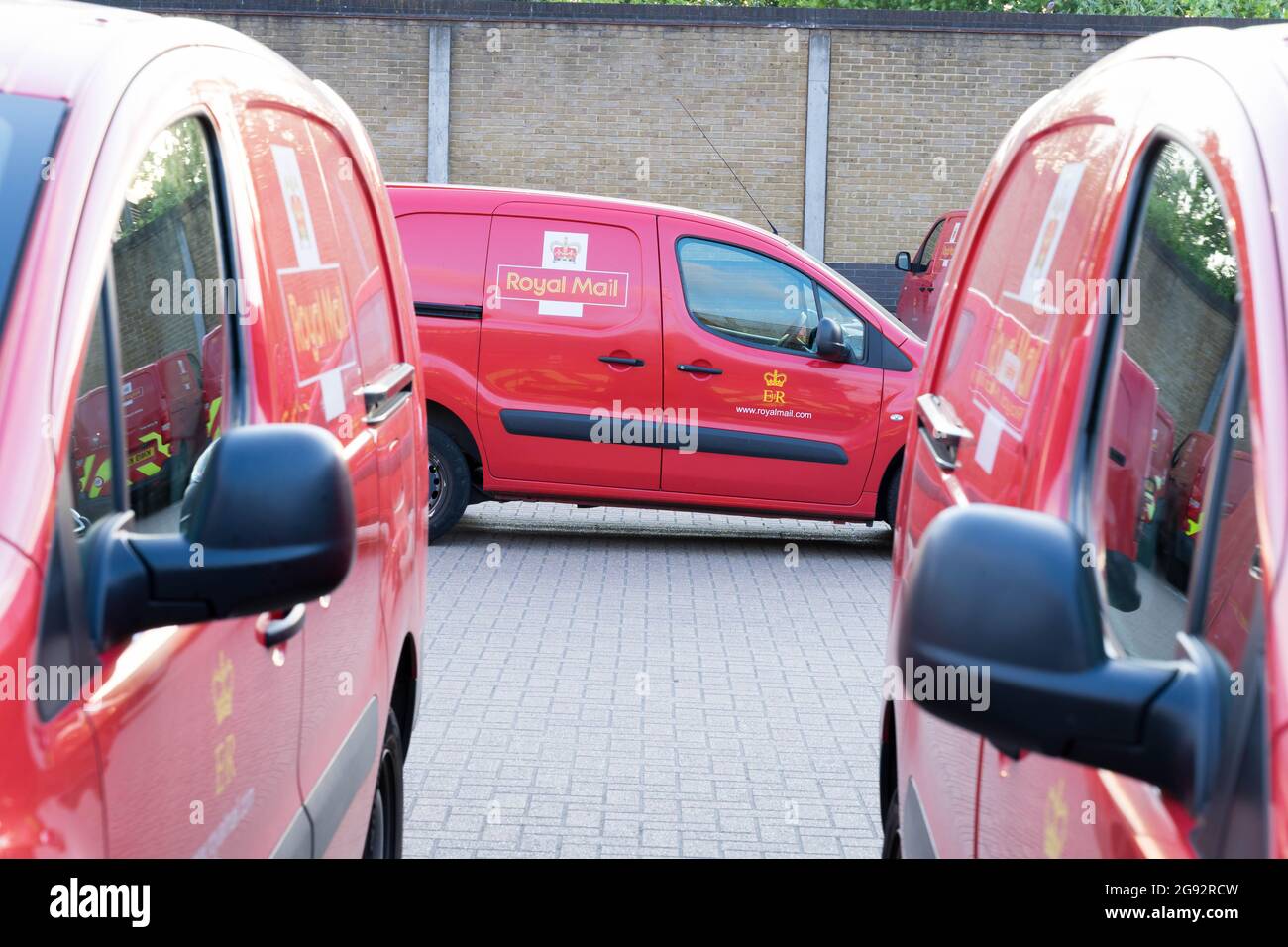side view of Red Royal mail delivery vans ready for posting delivery ...