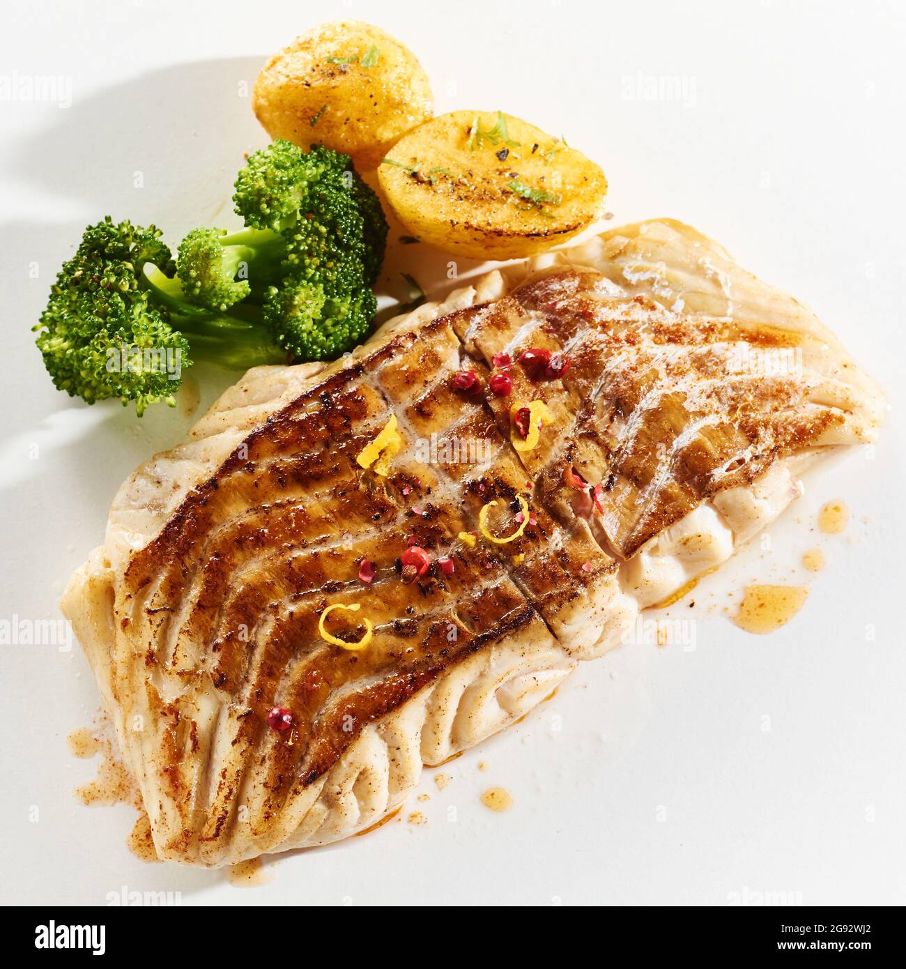 From above delicious grilled pollack fish steak served with broccoli ...