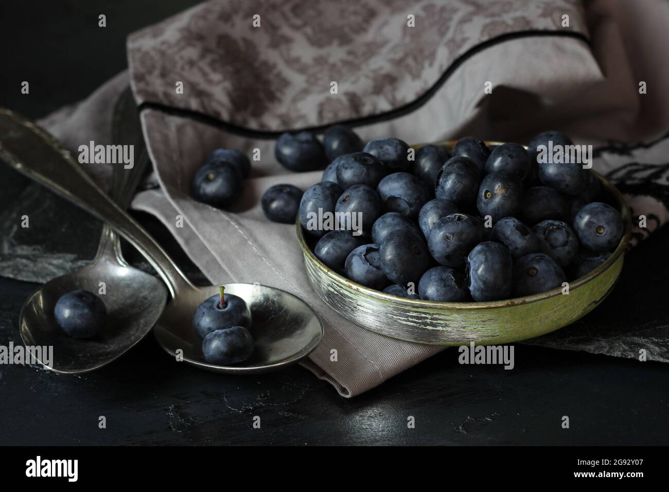 mystic light blueberries on dark background Stock Photo - Alamy